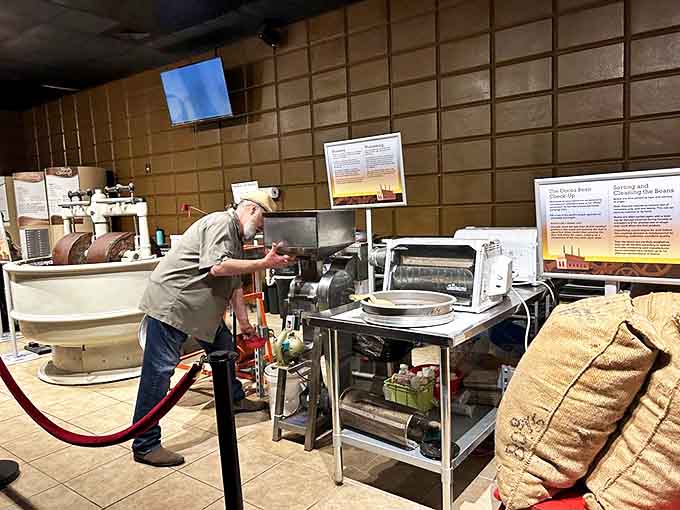 A craftsman tends to the chocolate-making equipment with the focus of a surgeon and the passion of an artist.