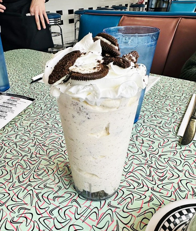Cookies and cream reimagined &ndash; Oreos don't just flavor this shake, they crown it like edible royalty atop a mountain of whipped cream.