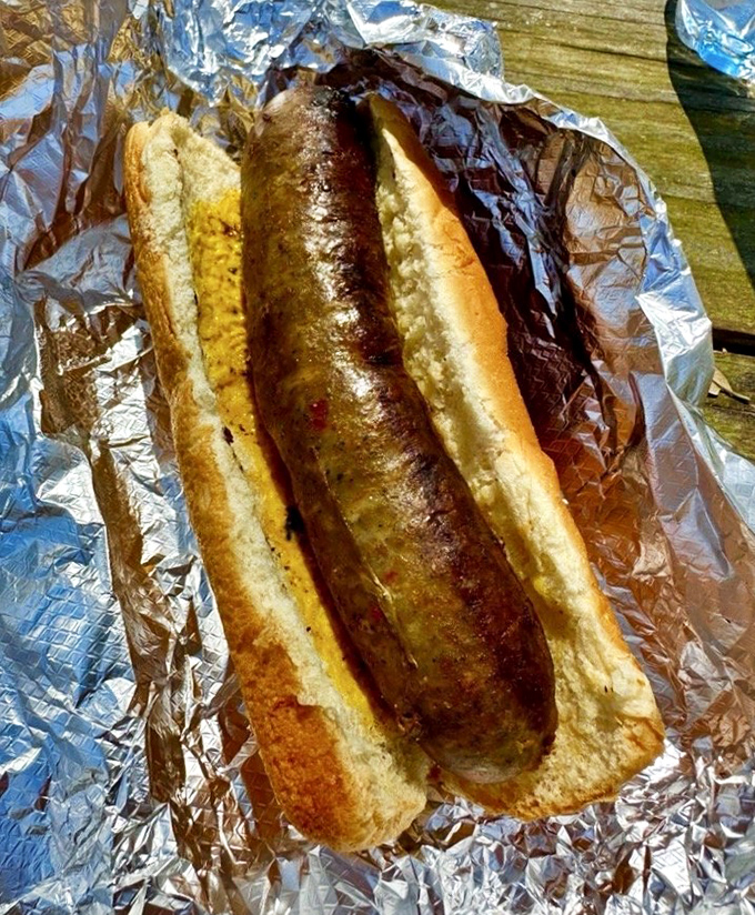 Simple pleasures done right, perfectly smoked sausage nestled in a soft bun with just enough mustard to make it sing.