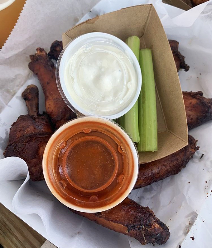 Every bite comes with a side of tradition &ndash; celery sticks and dipping sauces that complement rather than mask the natural smoky goodness.