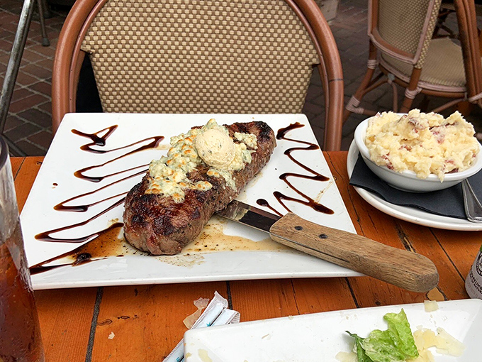 A perfectly cooked steak drizzled with blue cheese butter – proof that sometimes the simplest pleasures are the most satisfying.