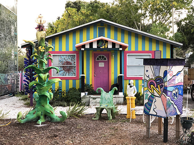 Dr. Seuss would feel right at home in this yellow and blue striped cottage where imagination runs the show.