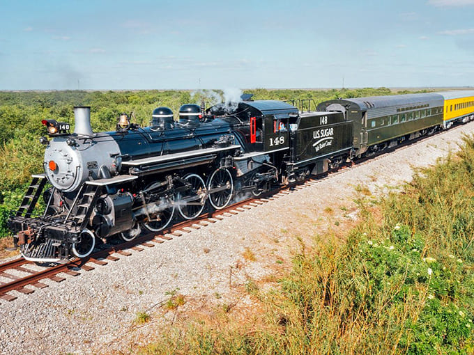 The steam locomotive commands attention with its classic lines and powerful presence, a reminder that engineering can be both functional and beautiful.