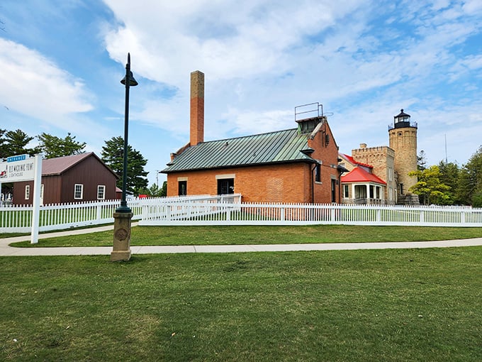 Morning light bathes the lighthouse grounds, highlighting the perfect symmetry between the main building and its iconic tower.