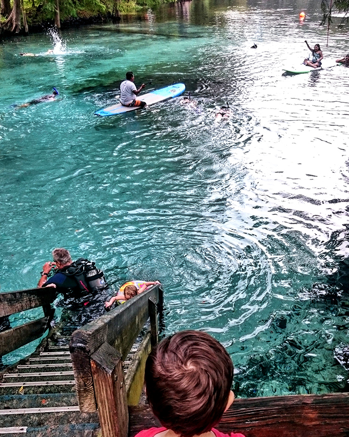 Paddleboarders glide over water so transparent it's like hovering above an aquarium &ndash; no special effects needed.
