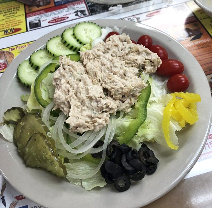 This isn't your sad desk lunch tuna&mdash;it's a mountain of freshly prepared salad surrounded by crisp veggies that actually makes eating healthy feel indulgent.