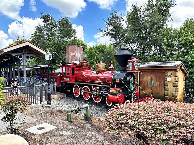 Steam billows dramatically as this magnificent locomotive prepares for another grand circle tour of the Magic Kingdom.