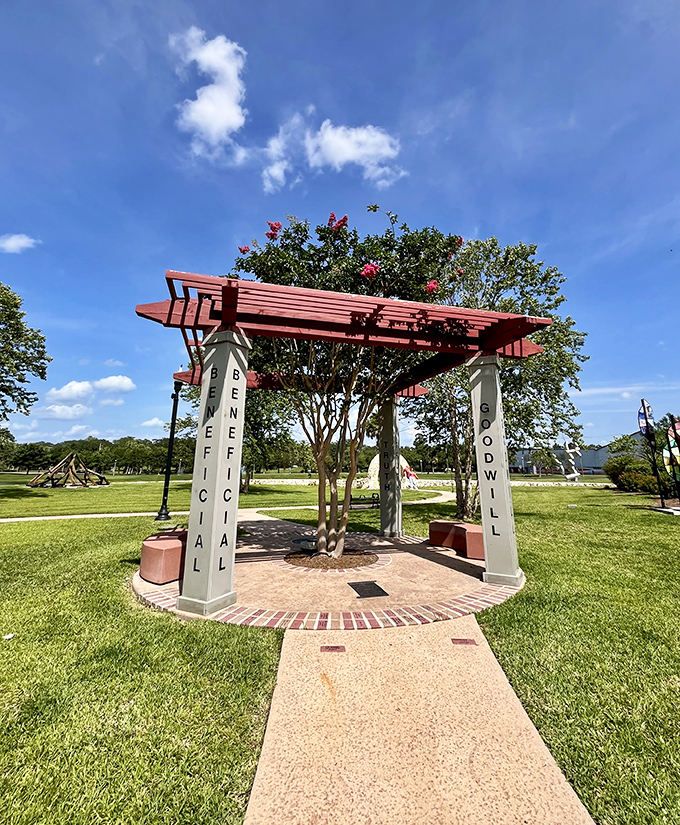 The "Beneficial Goodwill" arbor offers both shade and inspiration, its columns spelling out values that remind us what truly matters.