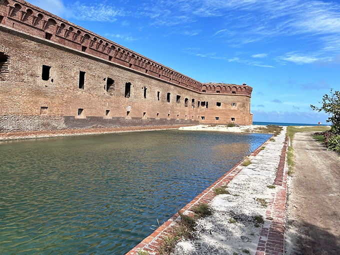 Weathered brick corridors stretch seemingly to infinity, each archway framing a portal through military history.