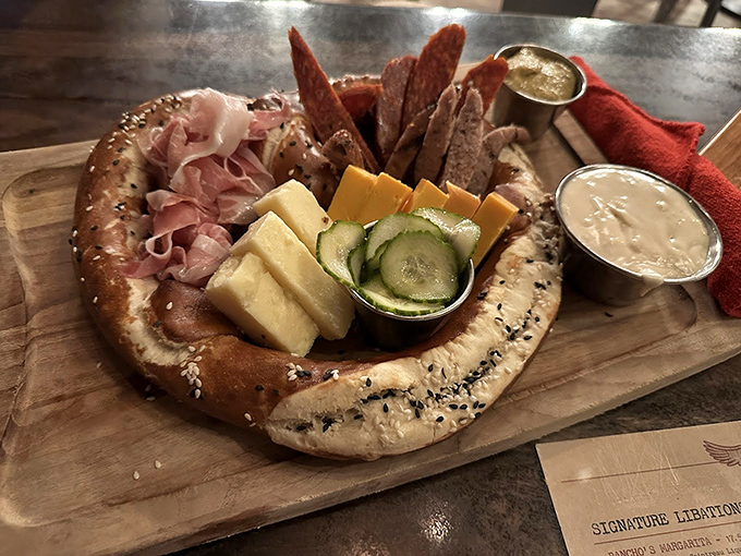 A pretzel ring becomes the perfect vehicle for an international peace treaty between prosciutto, cheese, and pickled vegetables.