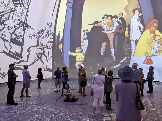 Strangers become fellow travelers in Dal&iacute;'s universe, sharing knowing smiles as elephants with impossible legs parade overhead in digital majesty.