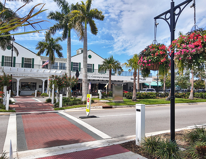 Local establishments line the avenue with their distinctive architecture, creating a cohesive visual experience that transports visitors to another time.