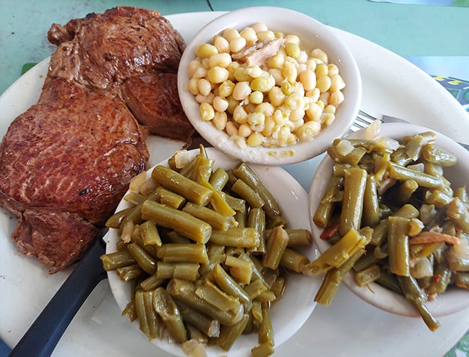 A perfectly grilled steak alongside country-style sides &ndash; proof that inland offerings stand proud next to their seafood cousins.