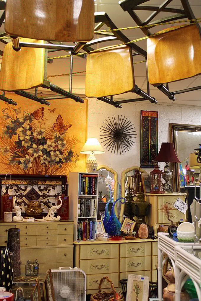 Mid-century furniture mingles with eclectic art in displays that would make your interior designer either weep with joy or quit on the spot.
