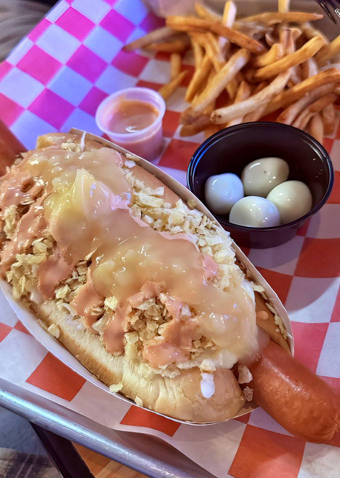 Colombian ingenuity at its finest&mdash;a hot dog smothered in sauces and potato chips, with quail eggs standing by like tiny flavor sentinels.