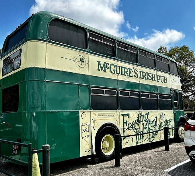 The iconic green and cream bus stands sentinel outside McGuire's, its mannequin passengers forever frozen in mid-craic.