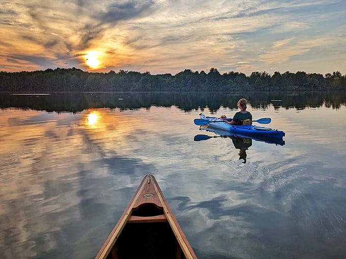 Sunset kayaking on Lake Ovid transforms paddlers into silhouettes against nature's most spectacular light show &ndash; no tickets required.