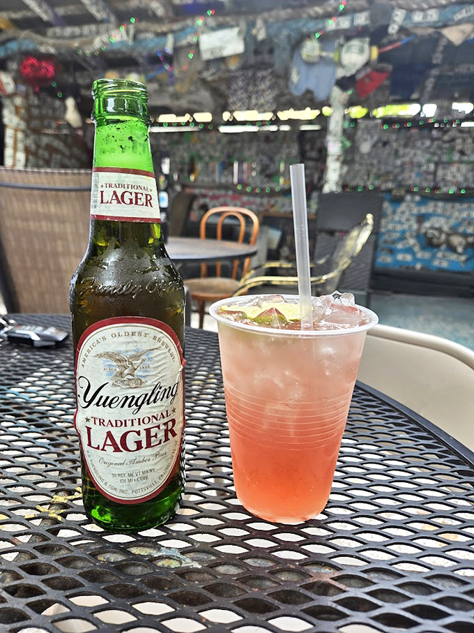 A cold Yuengling contradicts the "Warm Beer" warning &ndash; one of many pleasant surprises waiting at this eccentric establishment.