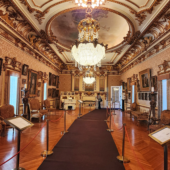 The music room where Chopin would feel inadequate. That chandelier alone probably cost more than your first car.