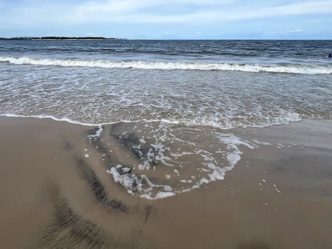 The gentle rhythm of waves meeting shore creates nature's most soothing soundtrack on this pristine Atlantic coastline.