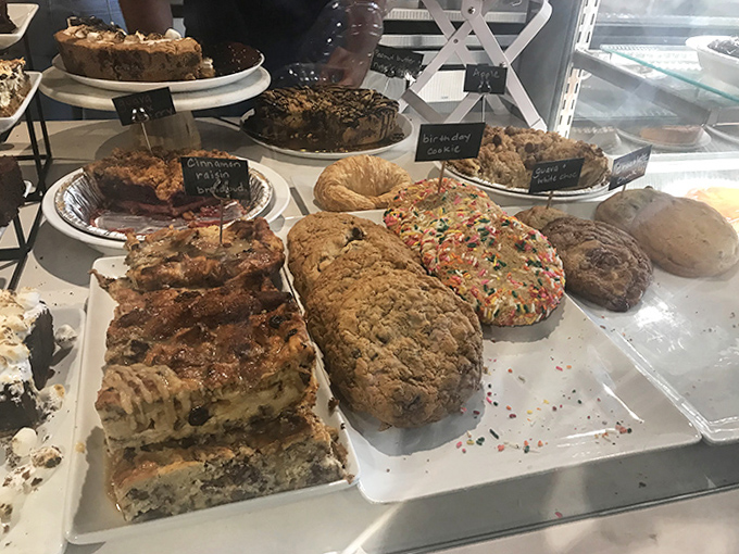 A display case that would make Willy Wonka jealous &ndash; cookies, brownies, and bars waiting to fulfill your sweetest dreams.