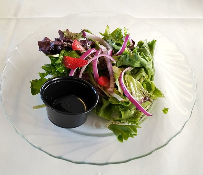 A fresh garden salad with vibrant vegetables and tangy dressing &ndash; the perfect opening statement before the main course of mystery begins.