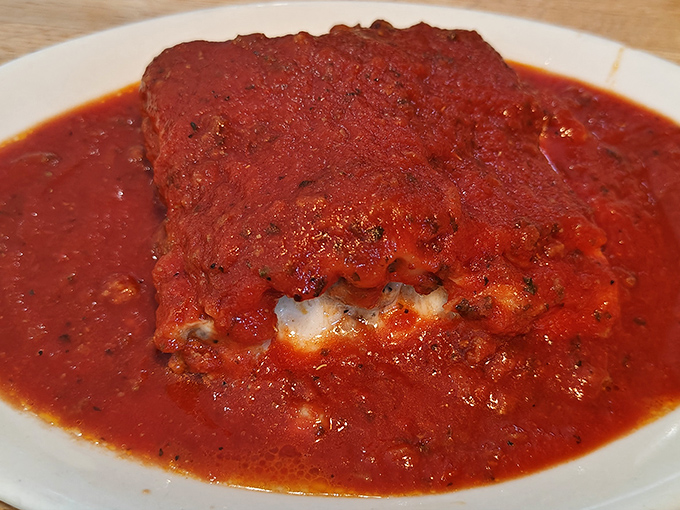 Saucy Baked Lasagna: The sauce doesn't just cover this lasagna &ndash; it embraces it like a long-lost relative, rich with tomato depth that speaks of patience and tradition.