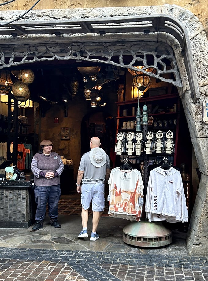 The shop entrance blends seamlessly into Batuu's landscape, with staff who stay perfectly in character as Black Spire Outpost residents.