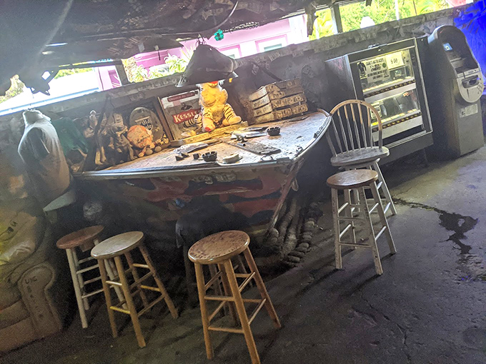 The makeshift boat-bar serves up no-nonsense drinks in an environment where "ambiance" means "whatever washed up on shore."