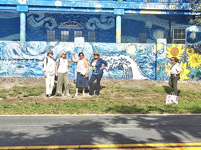 Visitors gather to experience the house firsthand, proving that great art has the power to bring people together in shared moments of wonder.