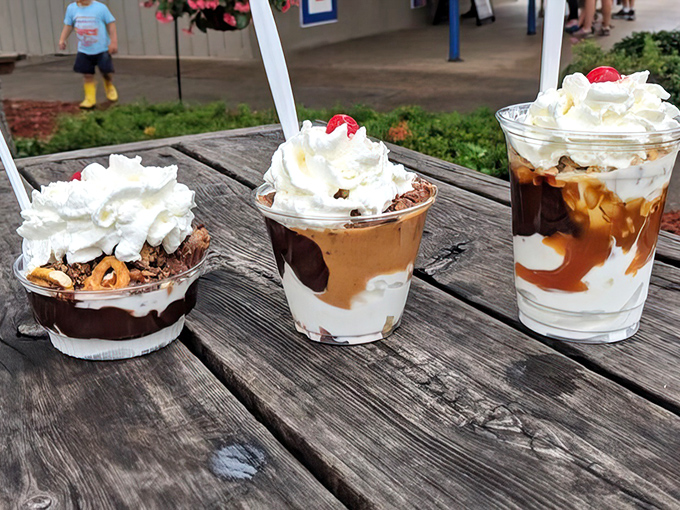 Captain Sundae's trio of temptations – chocolate brownie, caramel cookie, and chocolate-vanilla swirl sundaes topped with clouds of whipped cream and cherries.