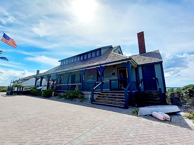 This historic lifesaving station perches on rocky shores, its weathered blue exterior a testament to Florida's maritime heritage.