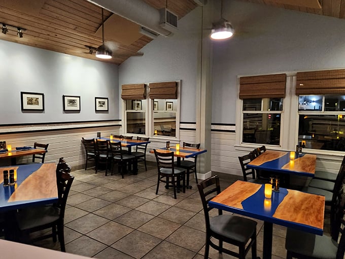 Guppy&rsquo;s rustic wooden interior gets a warm, inviting glow from its lighting, and the thatched roof adds just the right touch of beachy charm!