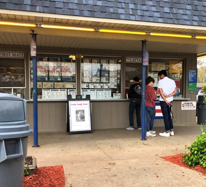 The simple walk-up window at Captain Sundae belies the complexity of choices that await inside – a menu board filled with nautical-themed frozen treasures.
