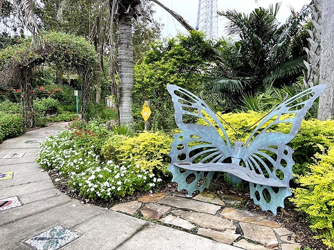 A powder-blue butterfly bench nestled among chartreuse foliage makes the perfect Instagram-worthy rest stop for weary garden wanderers.