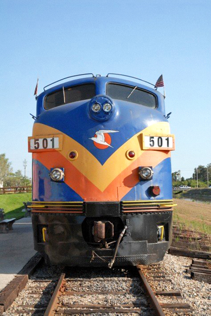 Up close with the Murder Mystery Dinner Train's impressive engine, showcasing the restored vintage details of this rolling restaurant.
