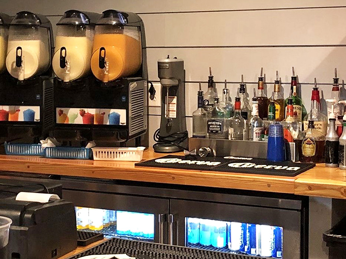 The bar area promises liquid refreshment with frozen drink machines standing at attention, ready to rescue you from Florida's heat.