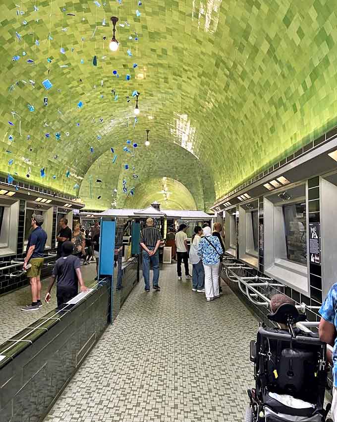 Visitors wander beneath the shimmering green ceiling, each lost in their own underwater daydream &ndash; or possibly wondering what's for lunch.