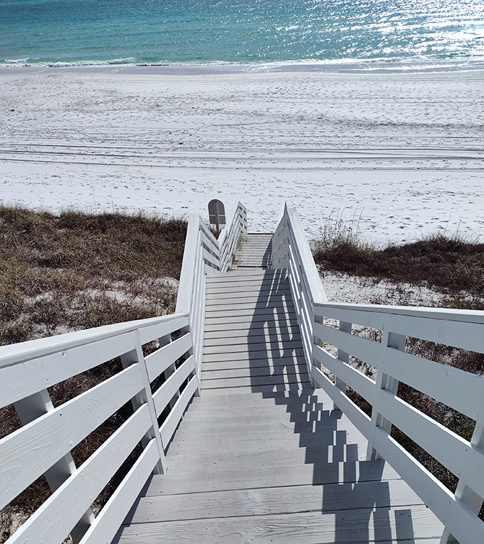 Boardwalk: The wooden pathway invites beach-goers down to paradise, each step bringing you closer to that first refreshing plunge.