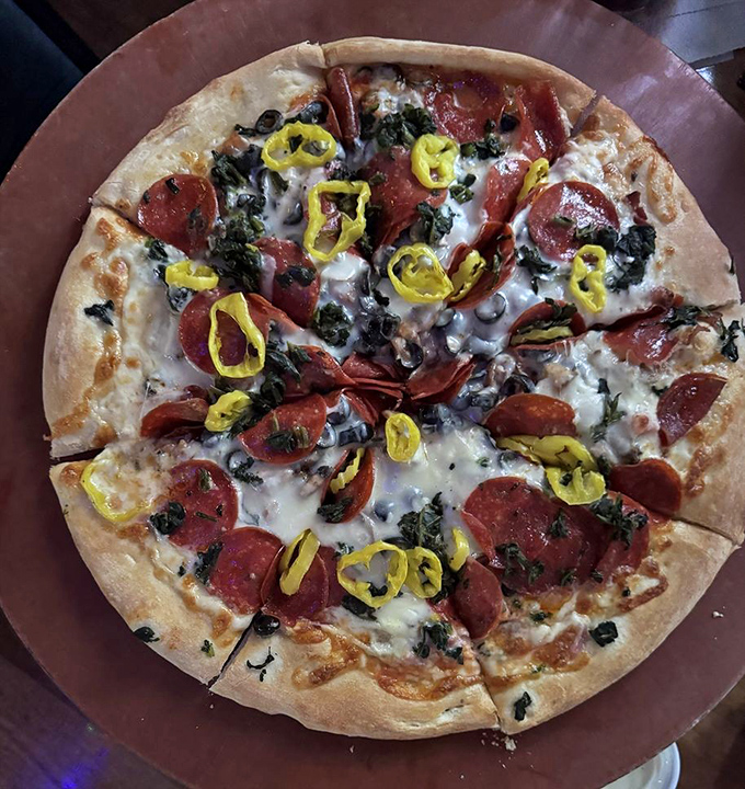 Vegetable garden meets cheese paradise on this custom creation, proving that sometimes the best pizza chef is you.