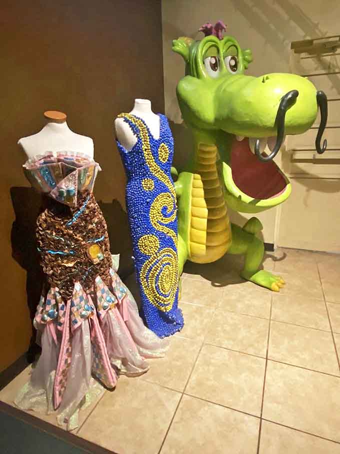 Who needs Project Runway when you've got candy wrappers? This whimsical dragon guards a collection of sweet fashion statements.