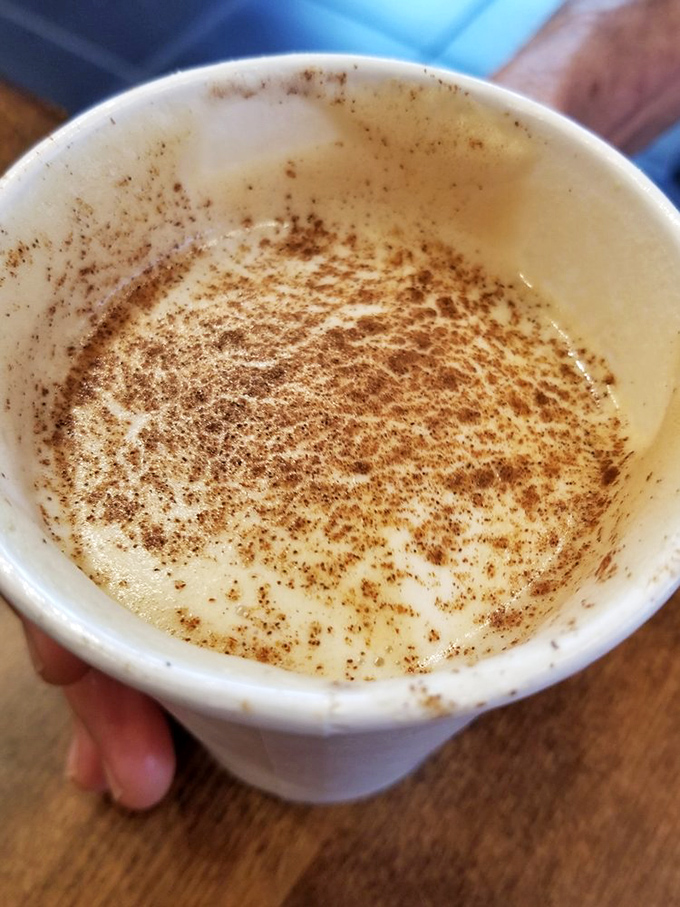 A dusting of cinnamon atop velvety foam &ndash; this cappuccino isn't just coffee, it's a warm hug in a mug.