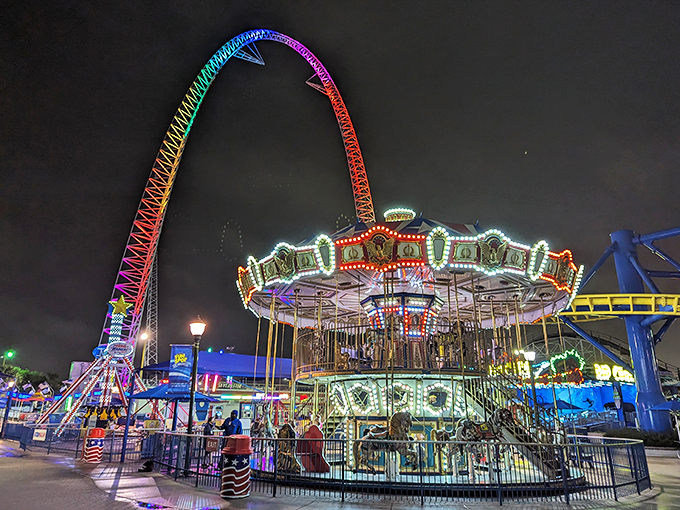 As dusk falls, the carousel transforms into a glowing time machine, its vintage charm enhanced by thousands of twinkling lights.