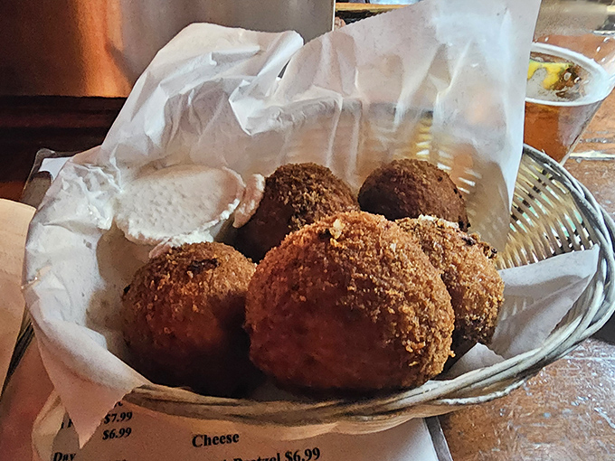 These golden-fried spheres of joy arrive hot and crispy, ready to reveal their molten, cheesy secrets with each bite.
