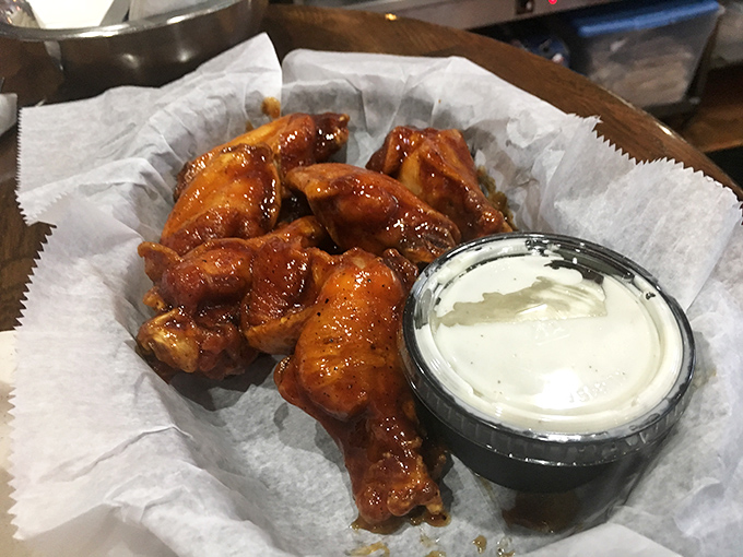 These wings aren't playing backup – they're sticky, sweet-heat showstoppers that might just steal the spotlight from the ribs.