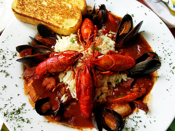 Cioppino: A seafood symphony in a bowl &ndash; crawfish, mussels, and shrimp nestled on rice with grilled bread standing by for sauce-sopping duty.