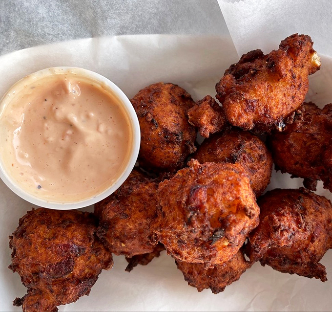 Crispy spheres of happiness hiding tender conch treasures inside &ndash; the appetizer that launches a thousand seafood feasts.