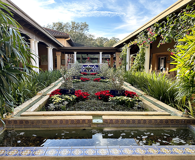 Mediterranean elegance meets botanical precision in this courtyard garden, where symmetry and color create a living painting.