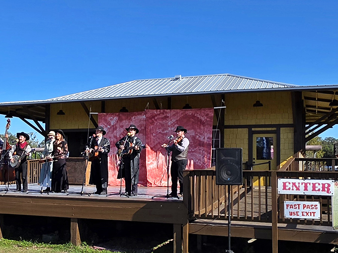 Musicians bring the soundtrack of yesteryear to life on the rustic stage, their period attire and acoustic instruments creating an authentic atmosphere.