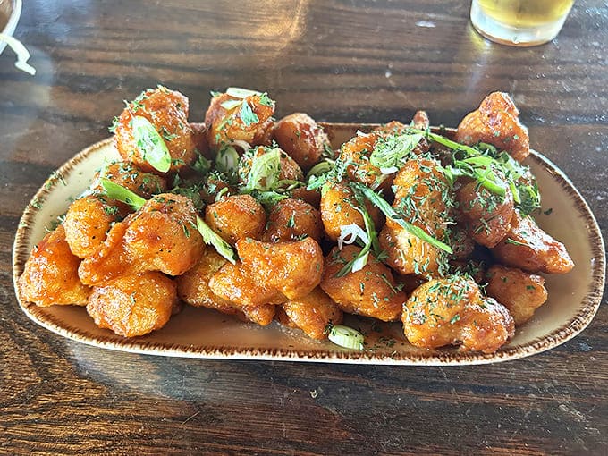 Firecracker Cauliflower Bites could convert even dedicated carnivores &ndash; crispy, spicy morsels tossed in tangy sauce and garnished with fresh herbs.